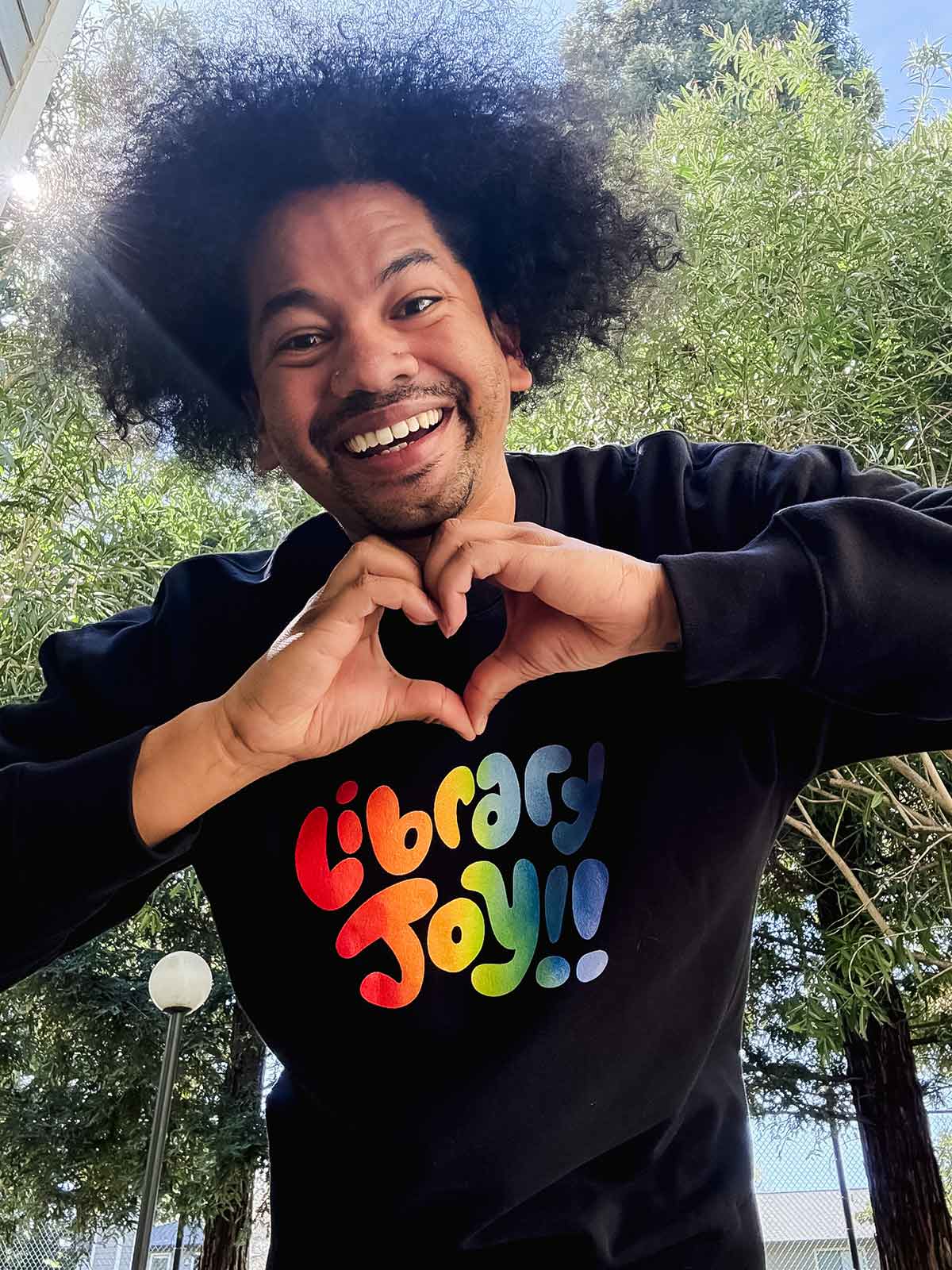 Mychal Threets: The Library is for Everyone unisex t-shirt — Out of Print